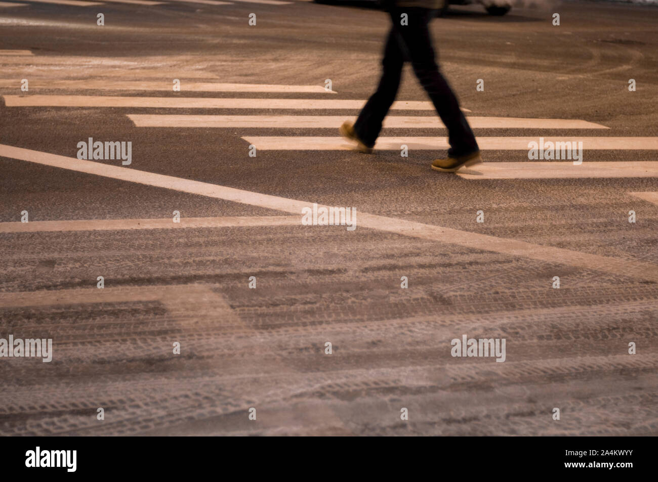 Man walking on cross-walk Stock Photo - Alamy