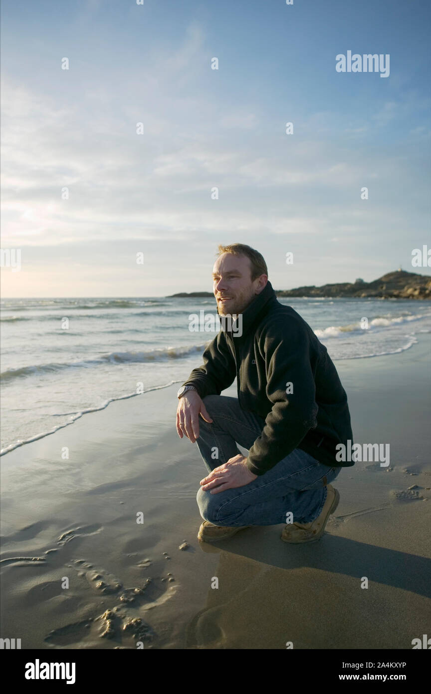 Man by the sea Stock Photo - Alamy