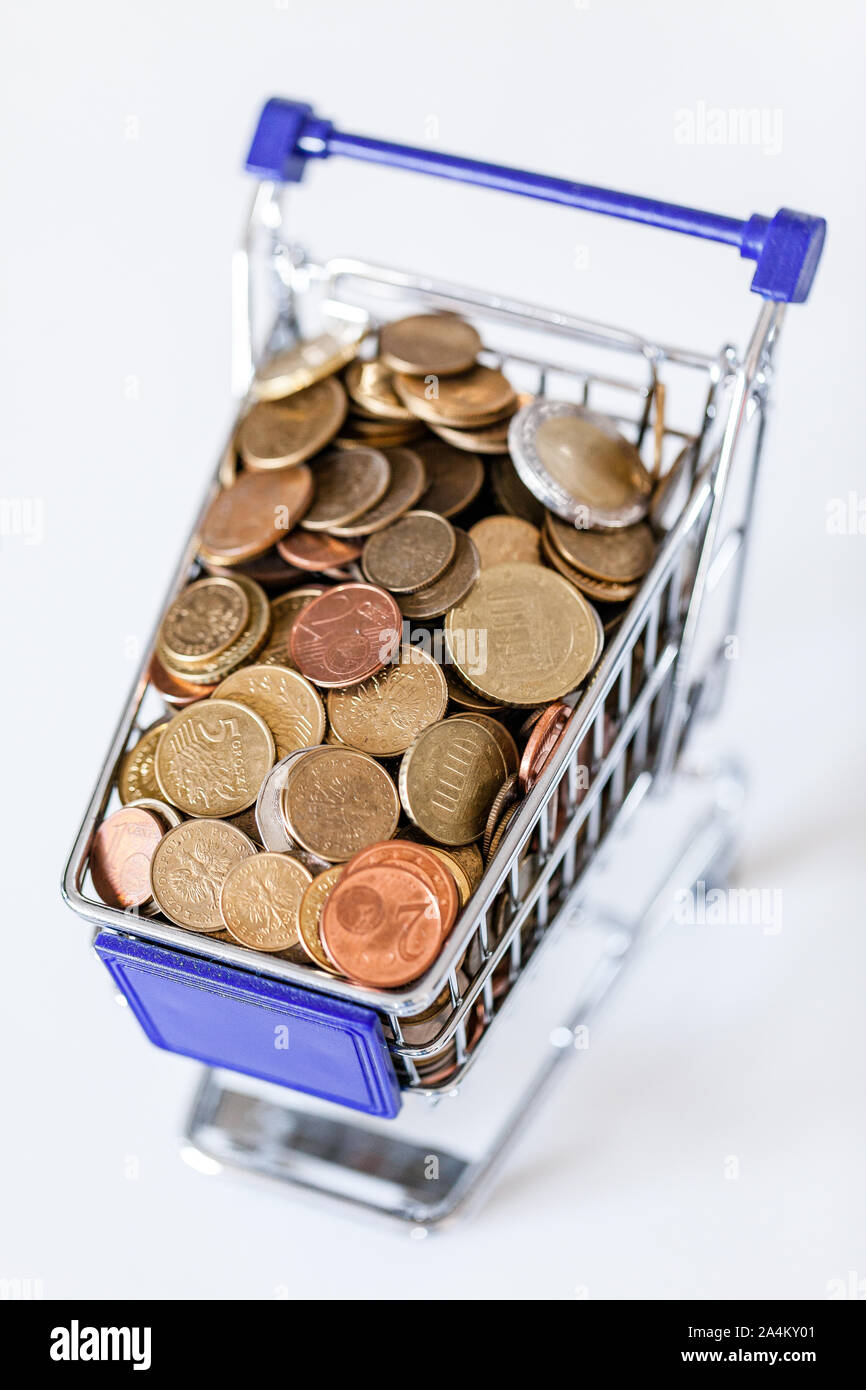 Shopping trolley with small coins Stock Photo - Alamy