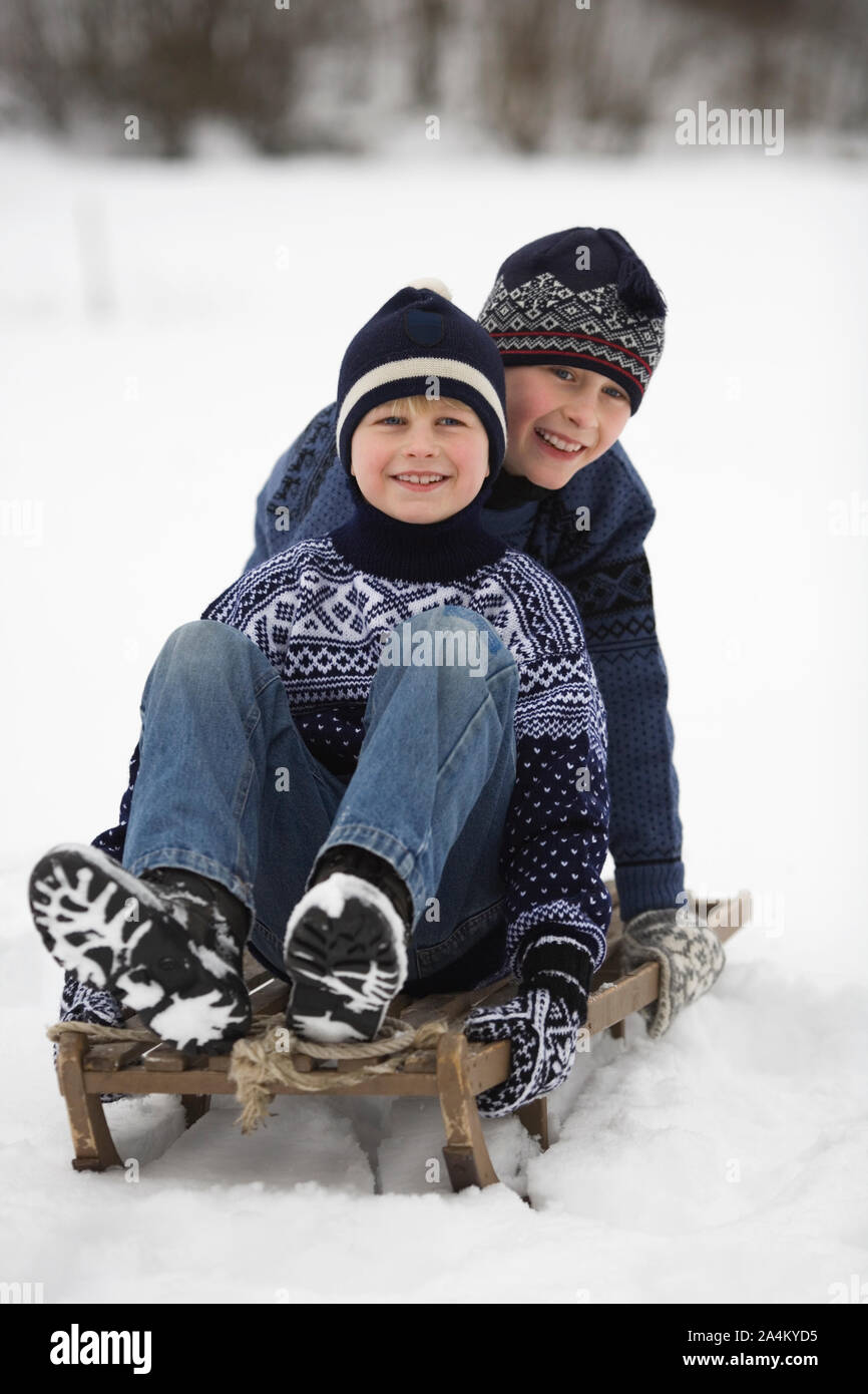 Boys on sledges hi-res stock photography and images - Alamy