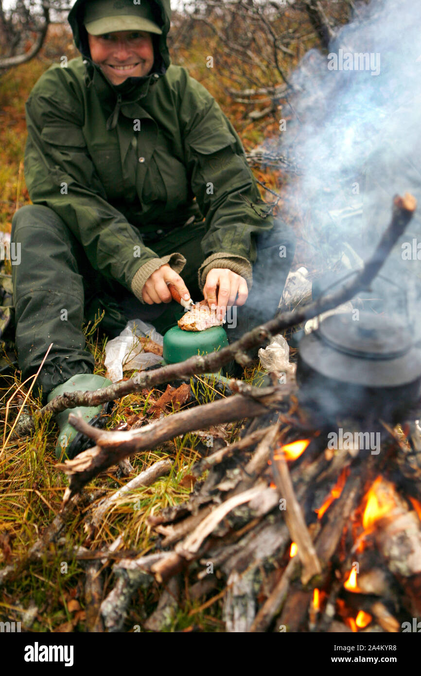 Hunter cooking. Campfire Stock Photo - Alamy