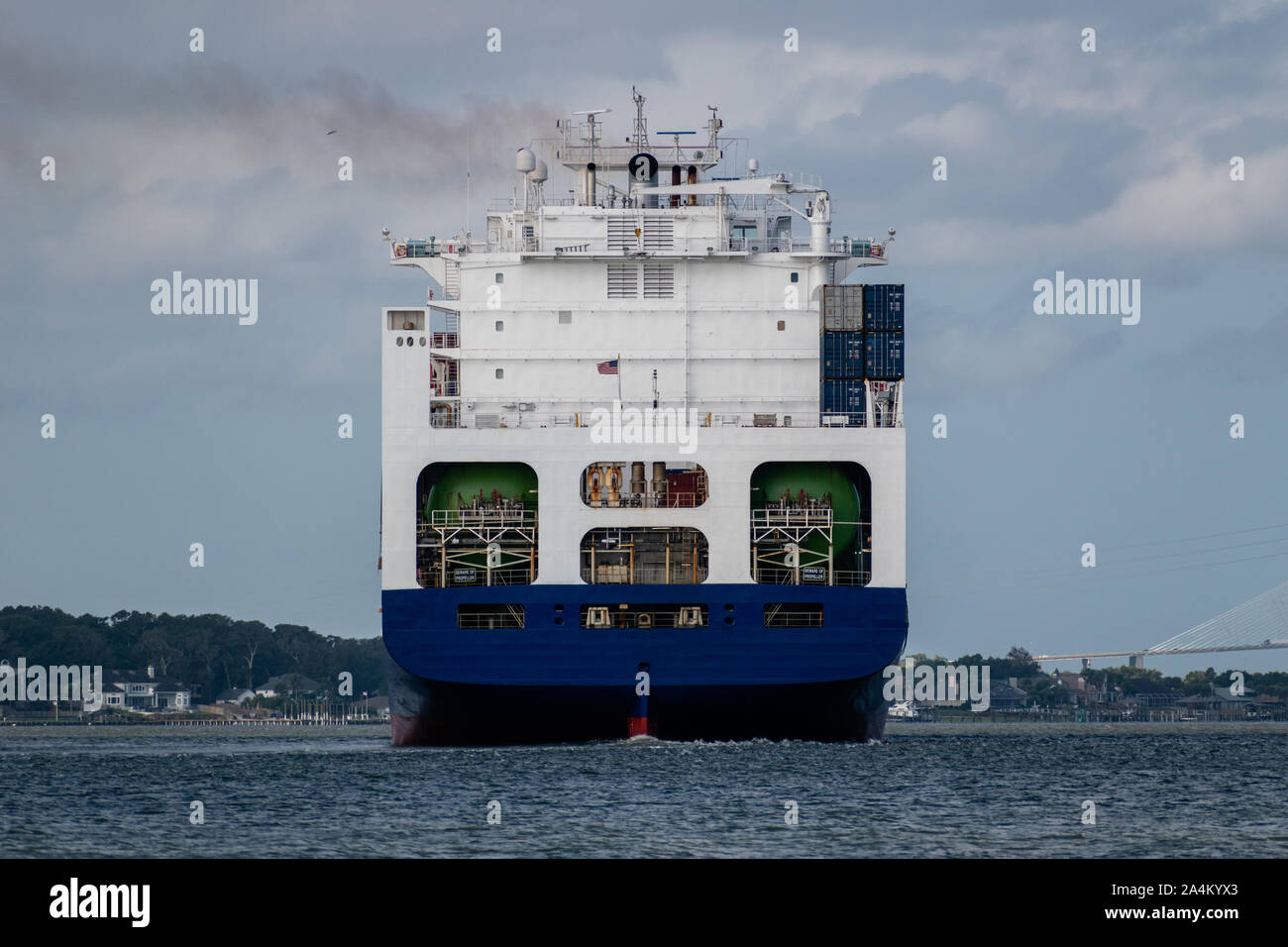 Large cargo container ship passing through river Stock Photo - Alamy