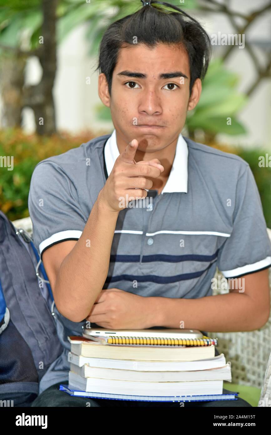 Pointing Young Minority Boy Student Stock Photo - Alamy