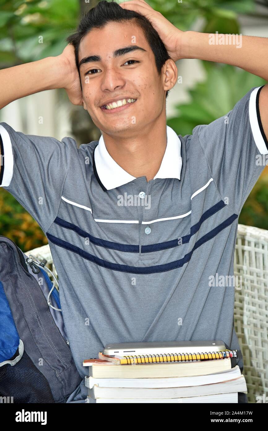 Forgetful Boy Student With Books Stock Photo - Alamy