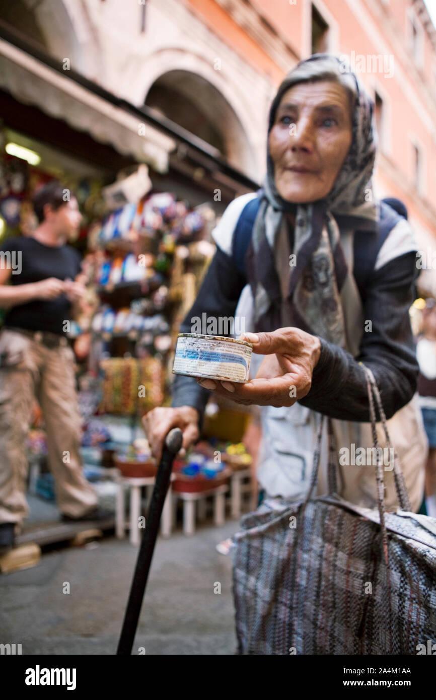 Old woman begging Stock Photo - Alamy