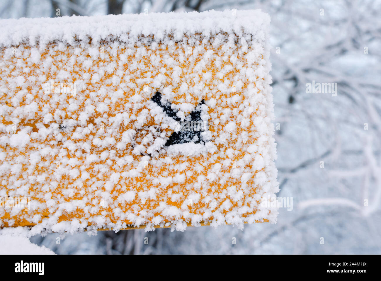 Frozen sign with arrow Stock Photo - Alamy