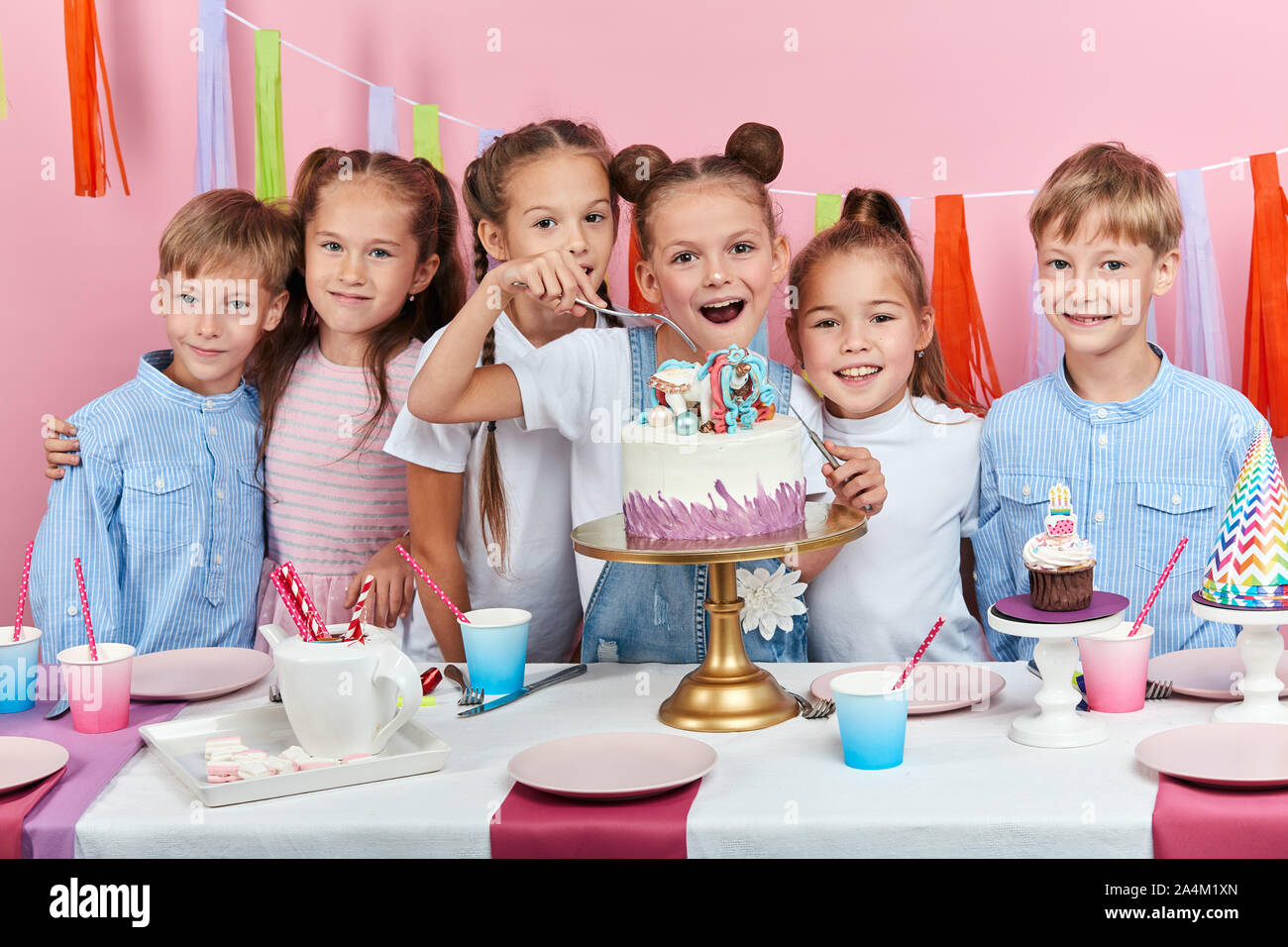 positive kids looking forward to taste dessert, posing to the camera ...