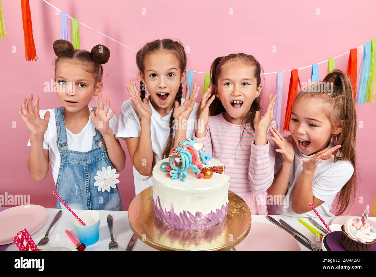 little beautiful girs screaming with joy at birthday party, happiness ...