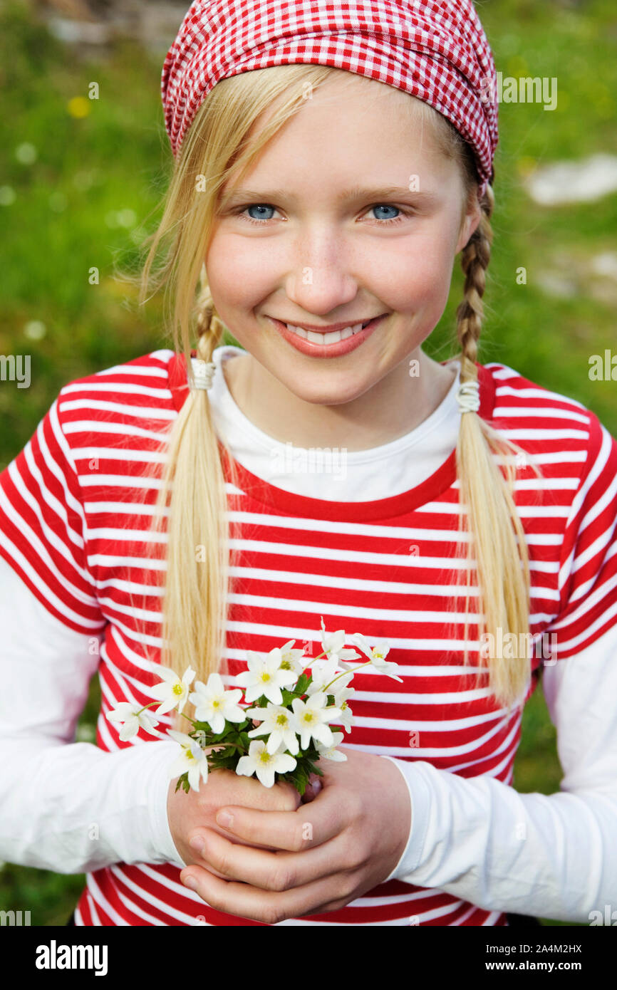 Girl with white anemones Stock Photo - Alamy