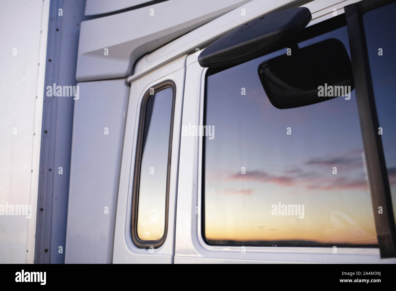 Sunset reflected in truck window Stock Photo - Alamy