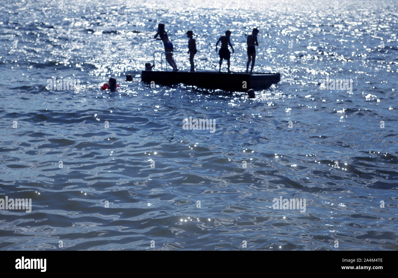 Children on bathing raft Stock Photo - Alamy