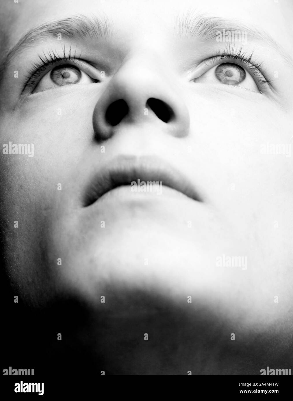 Boy with eyes wide open - looking up Stock Photo - Alamy