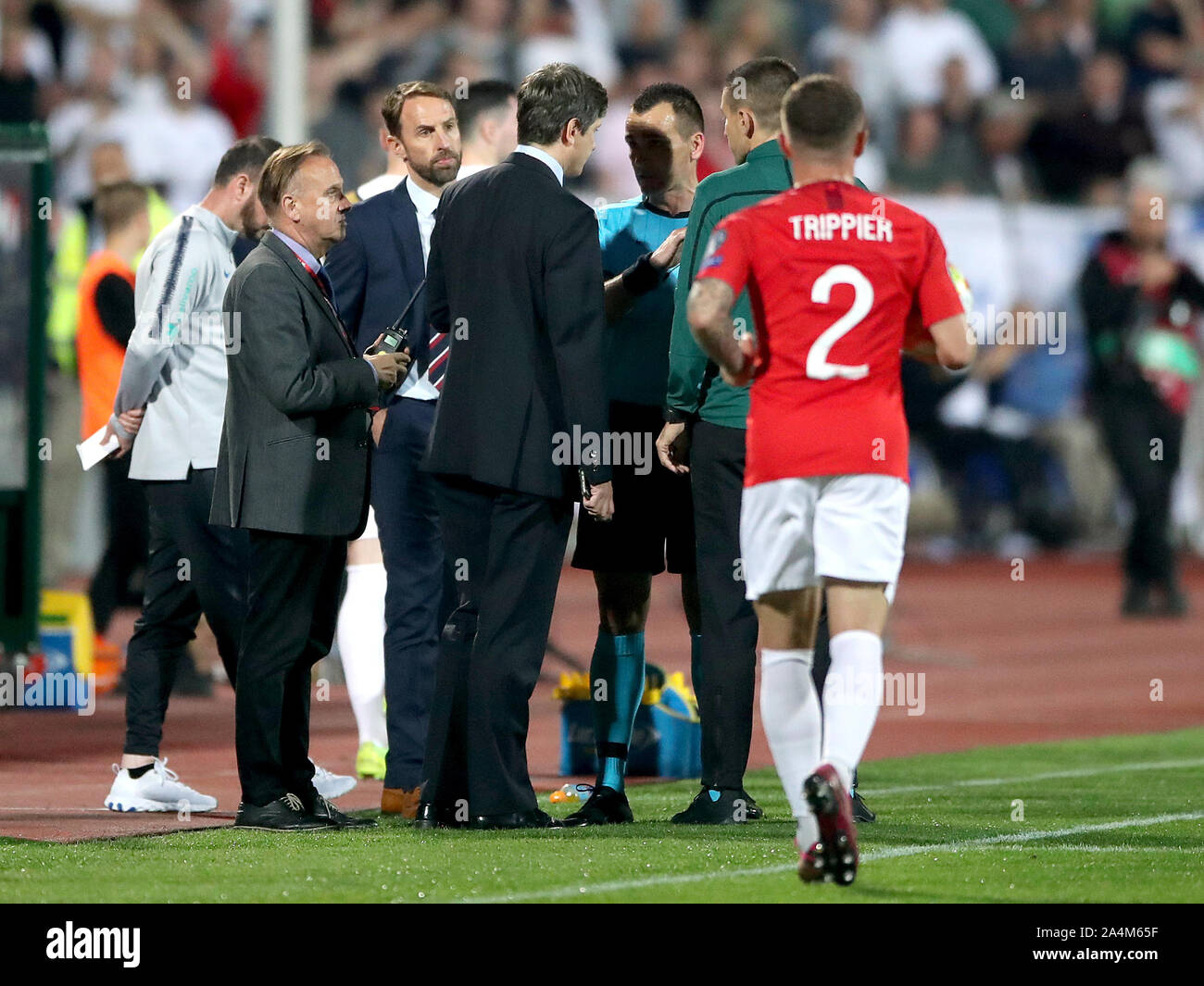 England manager Gareth Southgate (second left) and match referee Ivan ...