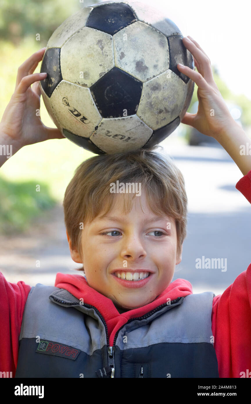 Boy with football Stock Photo - Alamy