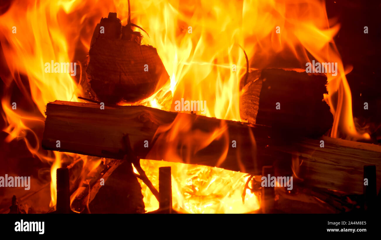 Closeup image of fire flames on burning wooden logs in fireplace Stock ...