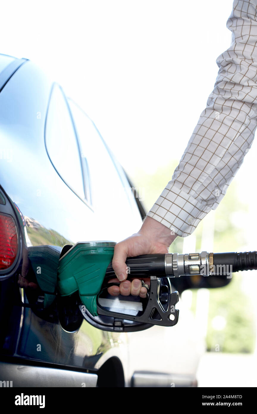 People filling cars with fuel hi-res stock photography and images - Alamy
