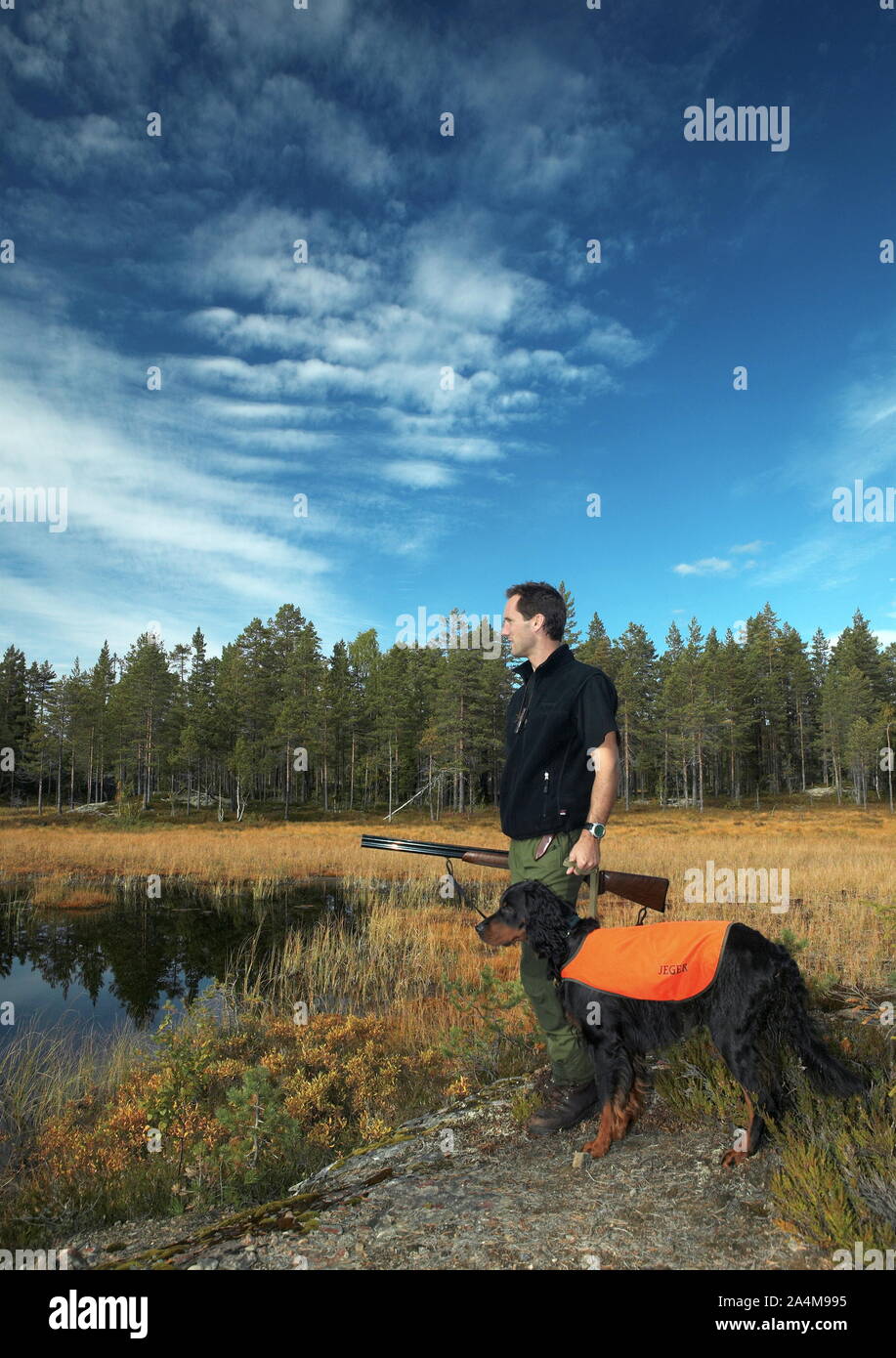 Man hunting with dog Stock Photo - Alamy