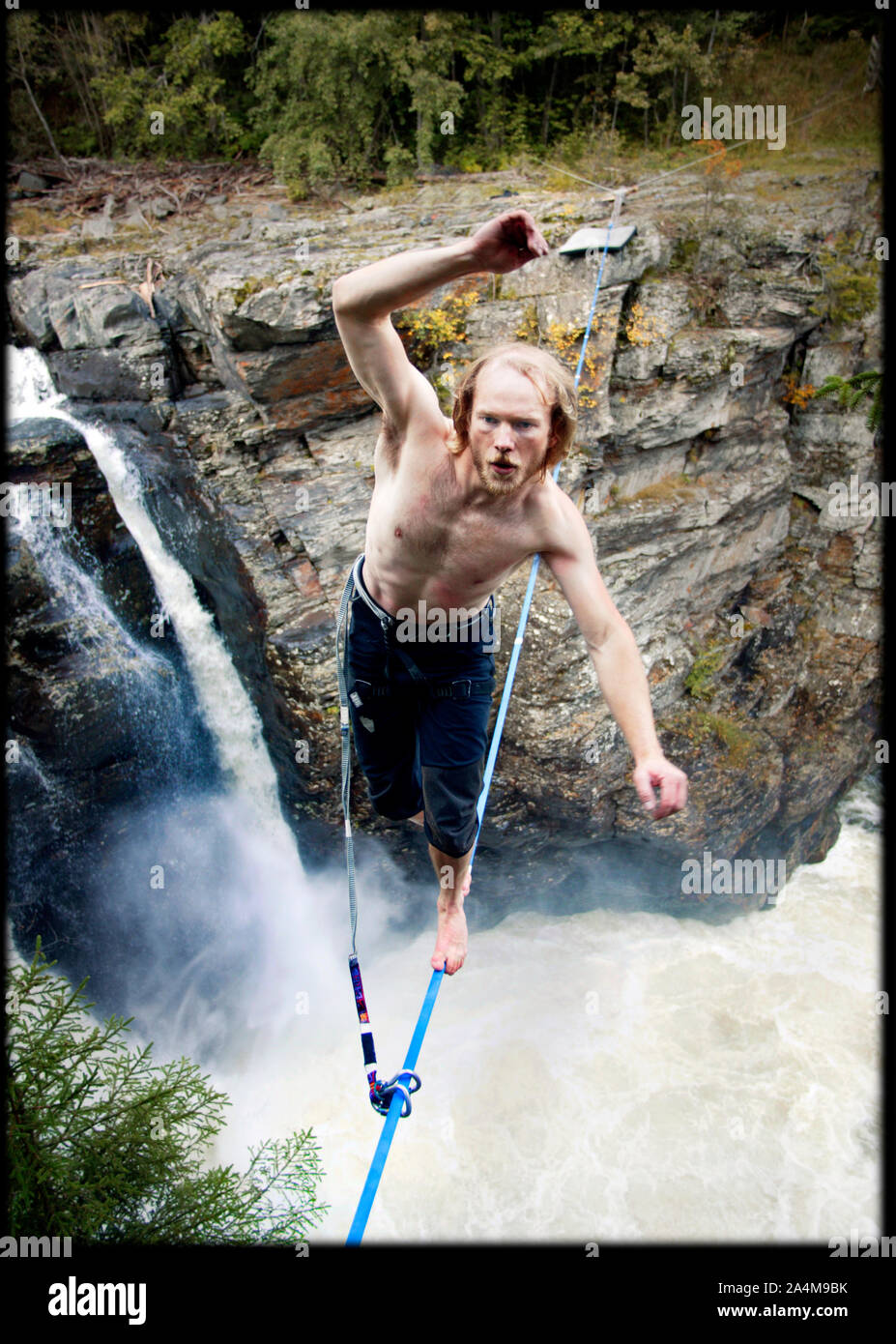 Tightrope walker - balancing on a thin line Stock Photo - Alamy