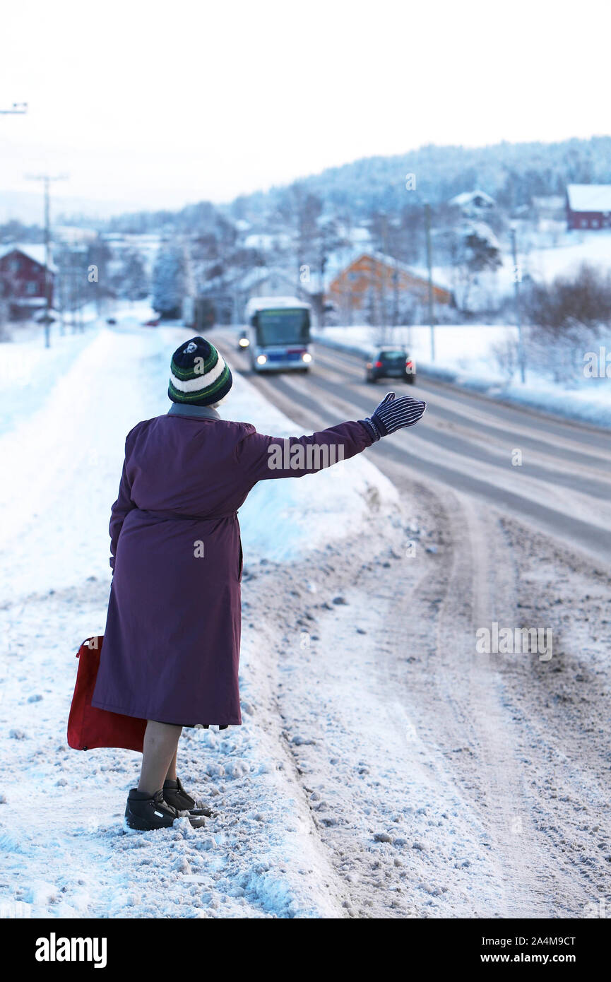 Senior woman waiting for bus Stock Photo - Alamy