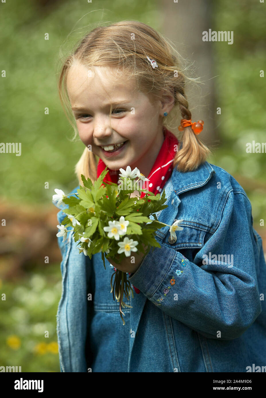 Girl with white anemones Stock Photo - Alamy