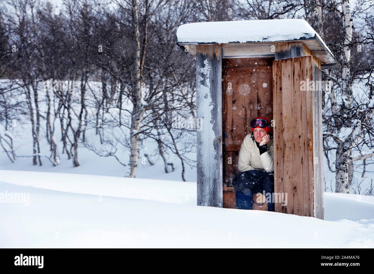 Man in the outhouse Stock Photo - Alamy
