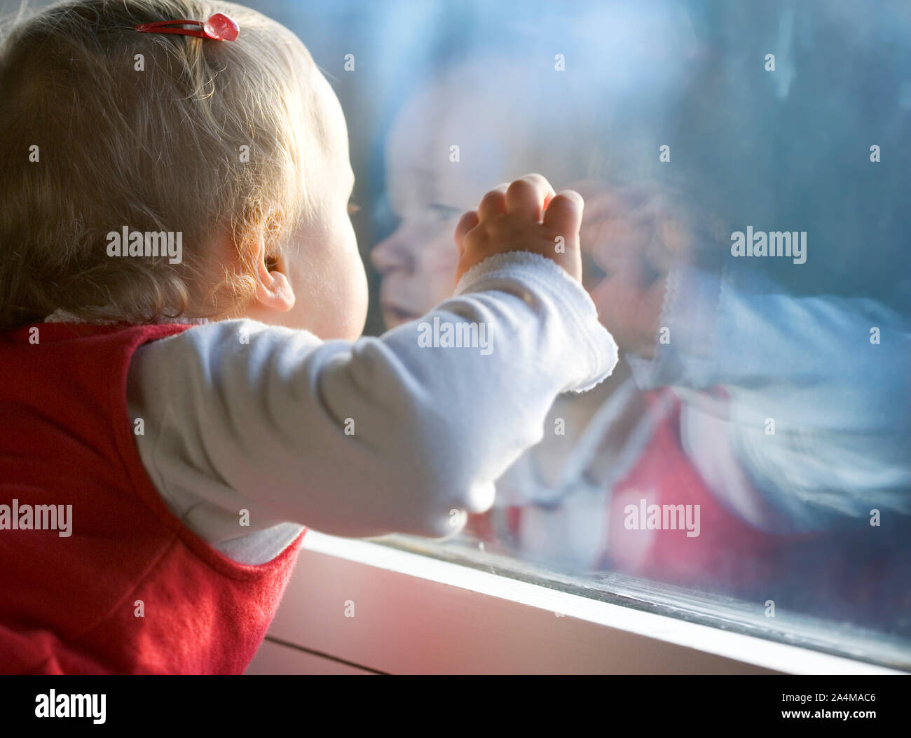 Little baby girl looking out of the window - expectations spectator ...