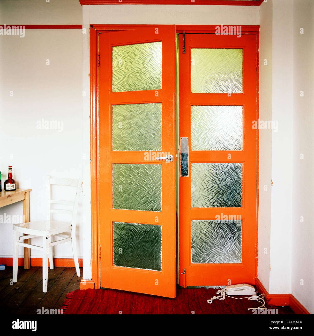 Orange glass door in the kitchen Stock Photo - Alamy