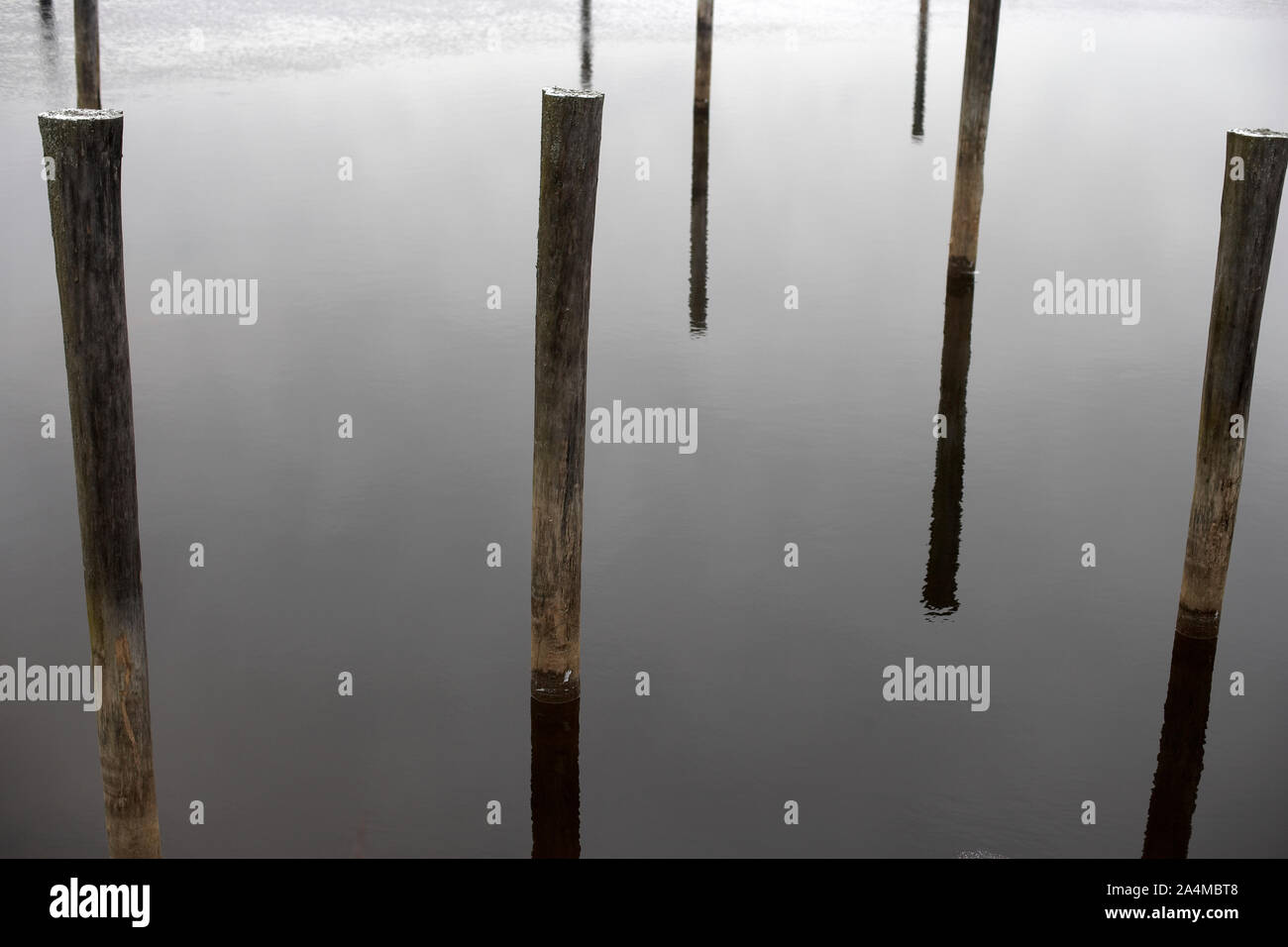 poles - wooden bits - bitt - empty - gone - moved - left Stock Photo ...