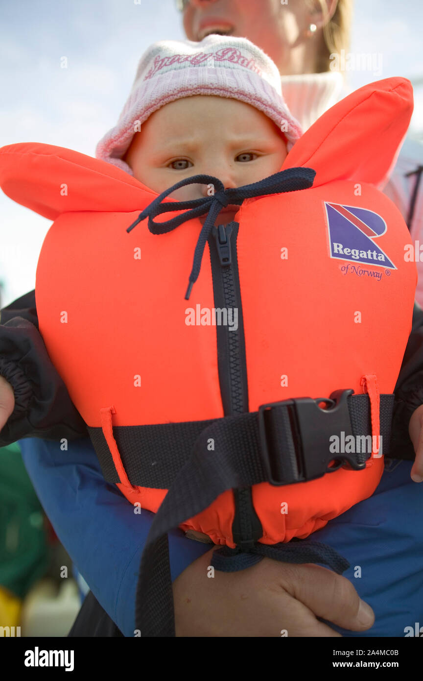 Baby with life jacket Stock Photo - Alamy