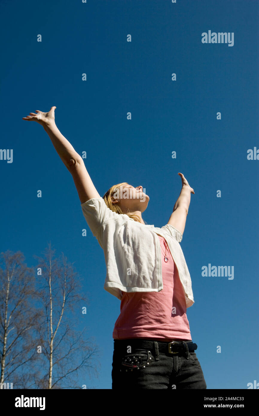 Young woman - arms stretched out Stock Photo - Alamy