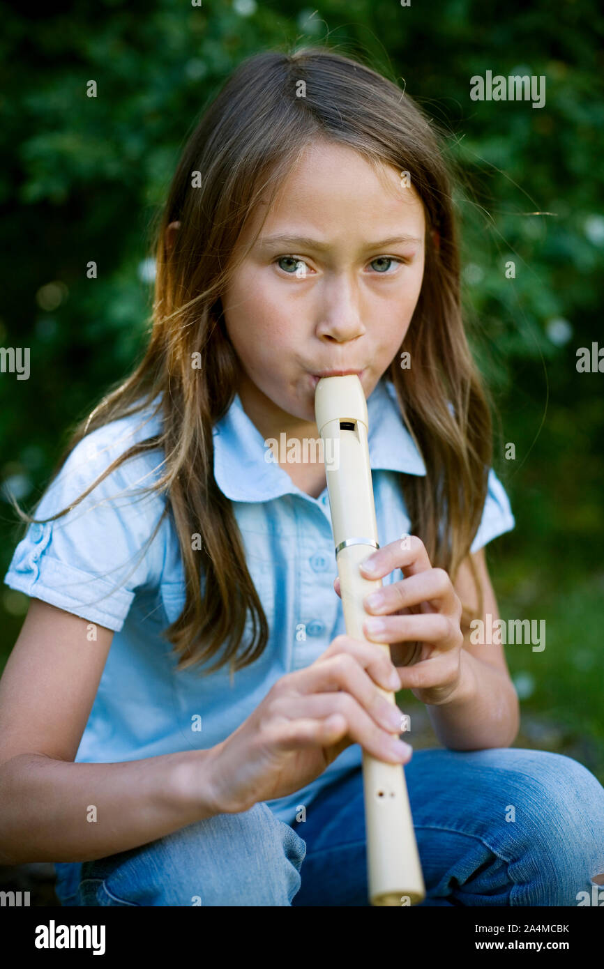 Girl playing recorder Stock Photo - Alamy