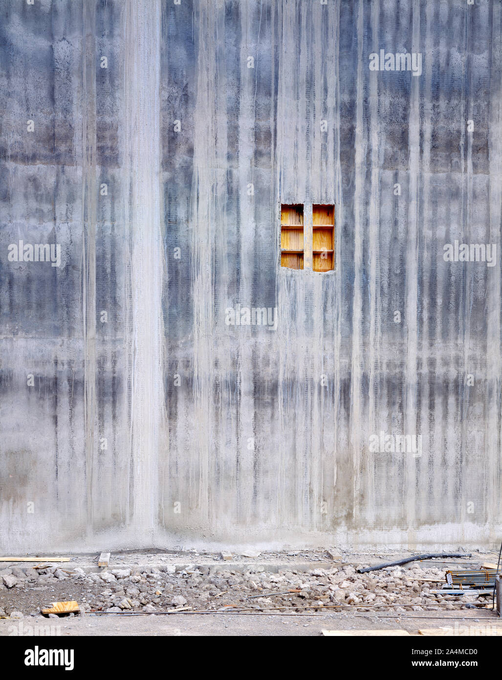 Large concrete wall - small window. Wicket Stock Photo - Alamy