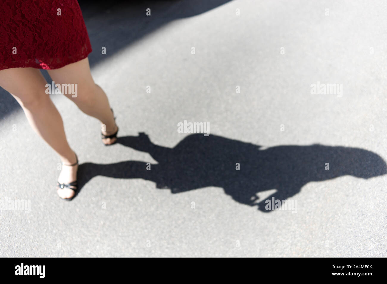 Woman Walking Down City Street Stock Photo - Alamy