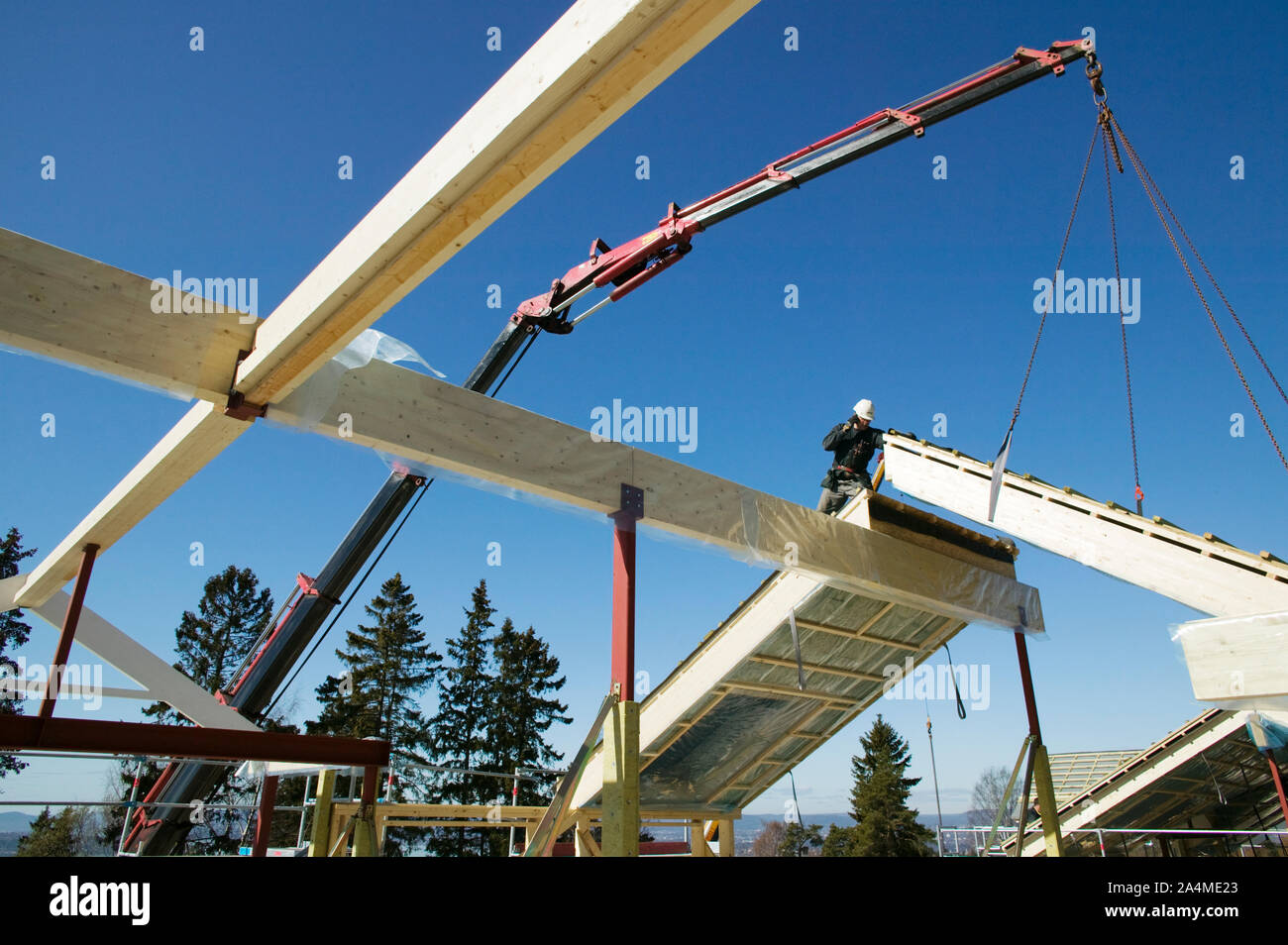 Man constructing a house - building elements Stock Photo - Alamy