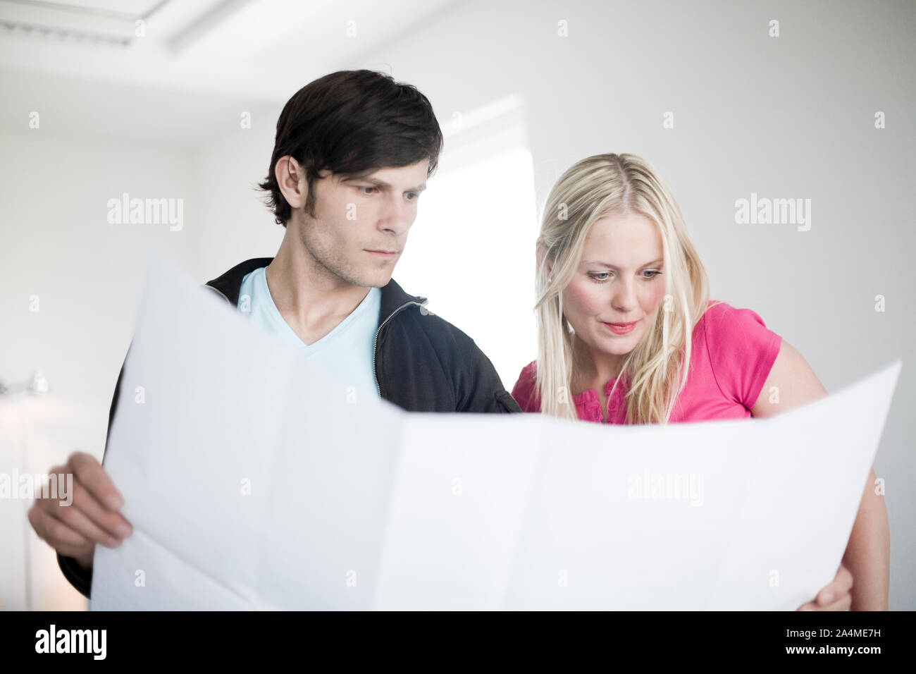 Couple with construction plan, life planning, blueprint - planning ...