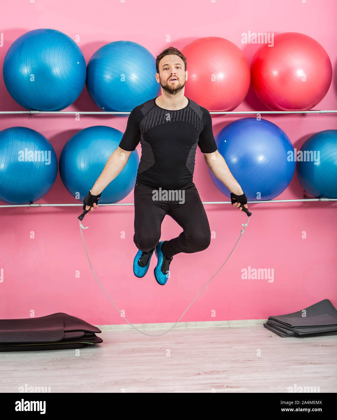 Strong man jumping rope in hi-res stock photography and images - Alamy