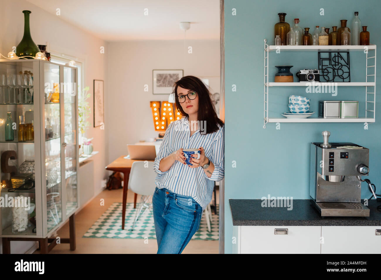 Woman standing her kitchen hi-res stock photography and images - Alamy