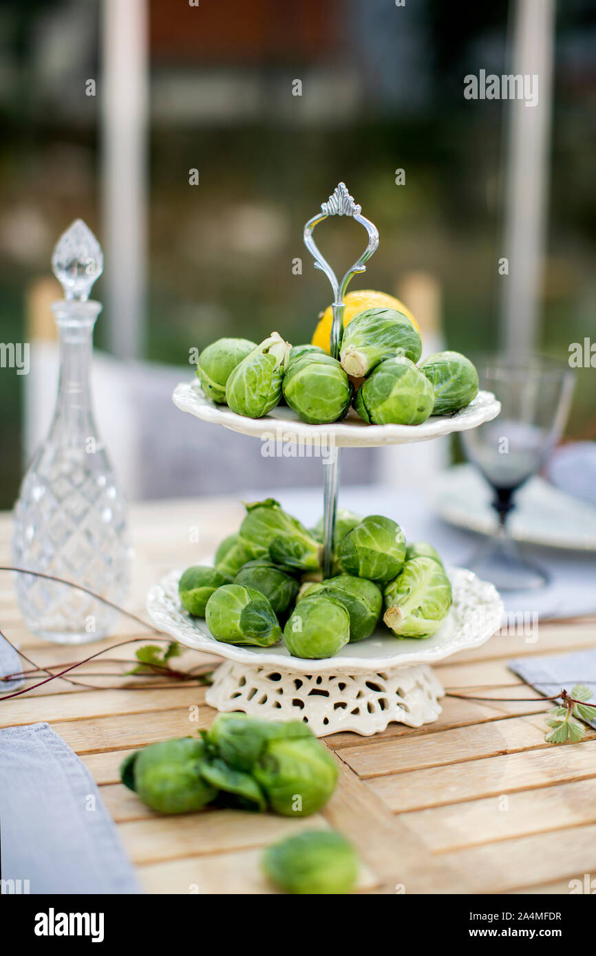 Brussel sprout on cake stand Stock Photo - Alamy