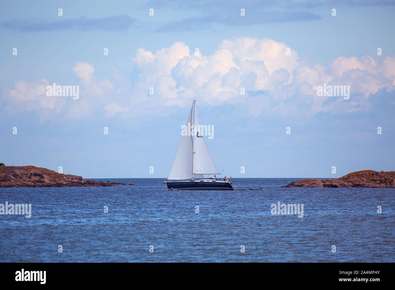 Sailboat in bay Stock Photo - Alamy