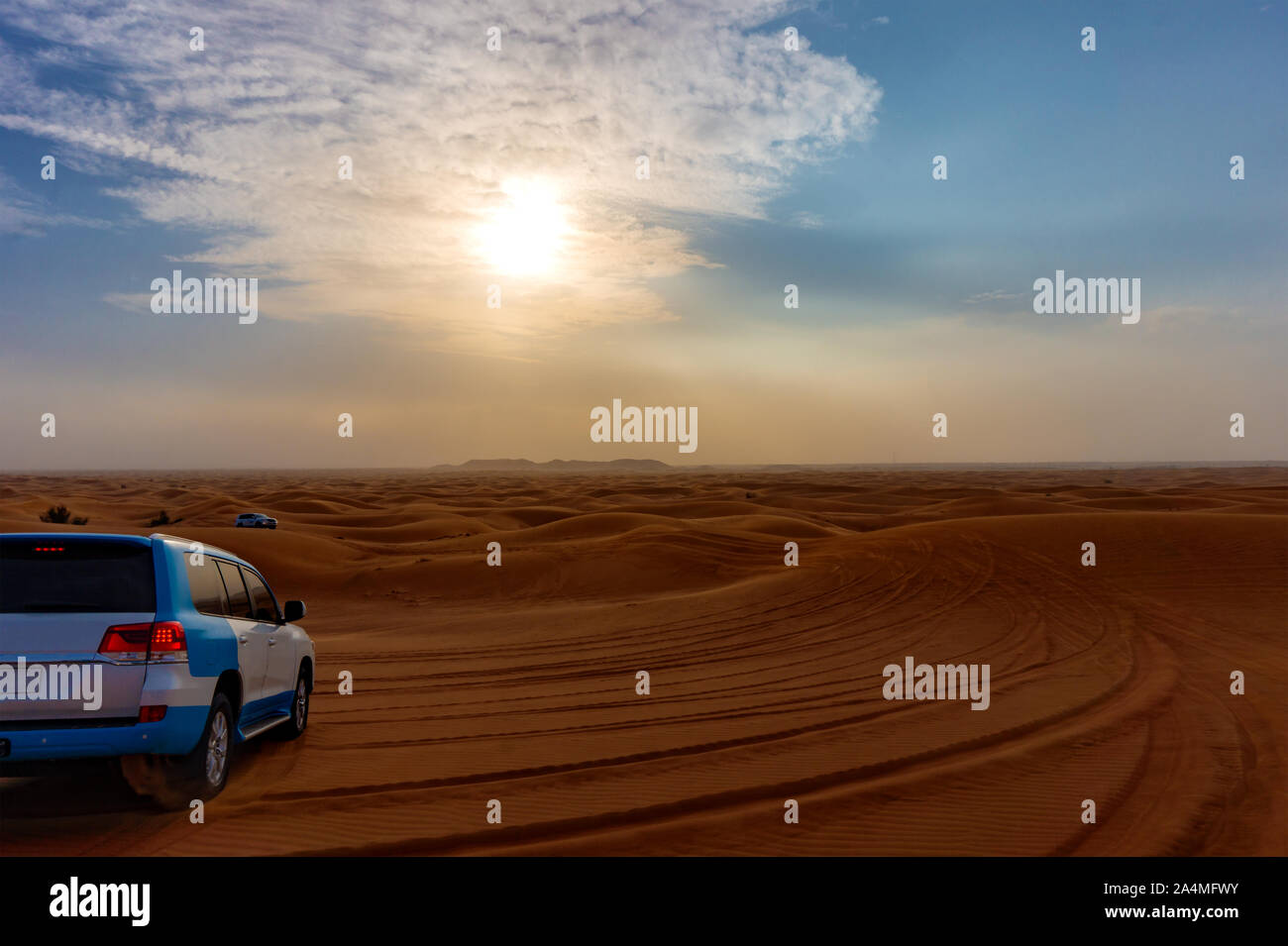 Desert safari sand bashing adventure in Dubai at sunset Stock Photo - Alamy