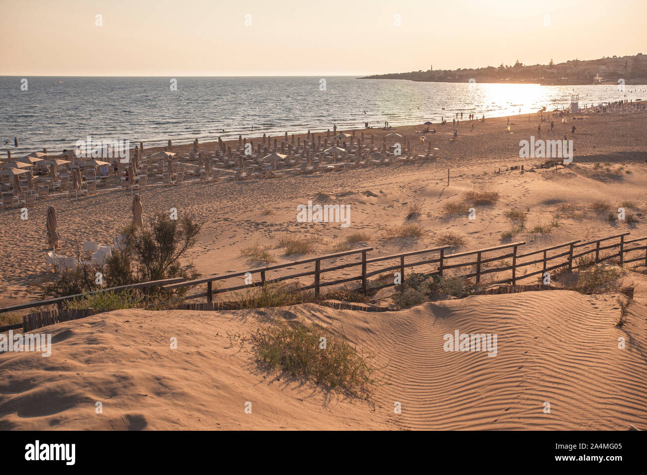 Modica Beach at sunset Stock Photo - Alamy