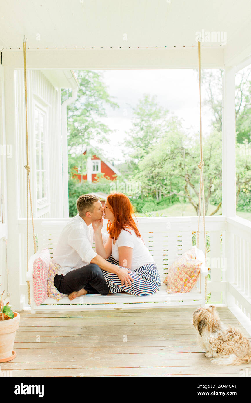 Couple porch swing two people hi-res stock photography and images - Alamy