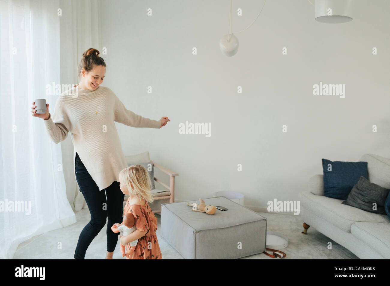 Mother dancing with daughter Stock Photo - Alamy