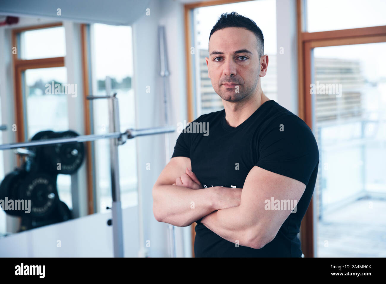 Portrait of gym trainer Stock Photo - Alamy