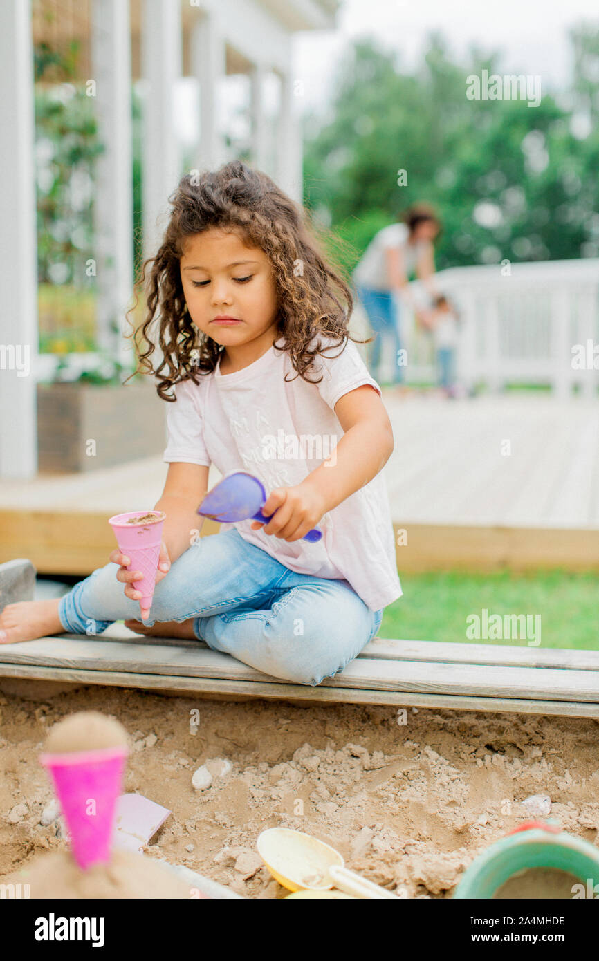 Girls playing in the sand hi-res stock photography and images - Alamy