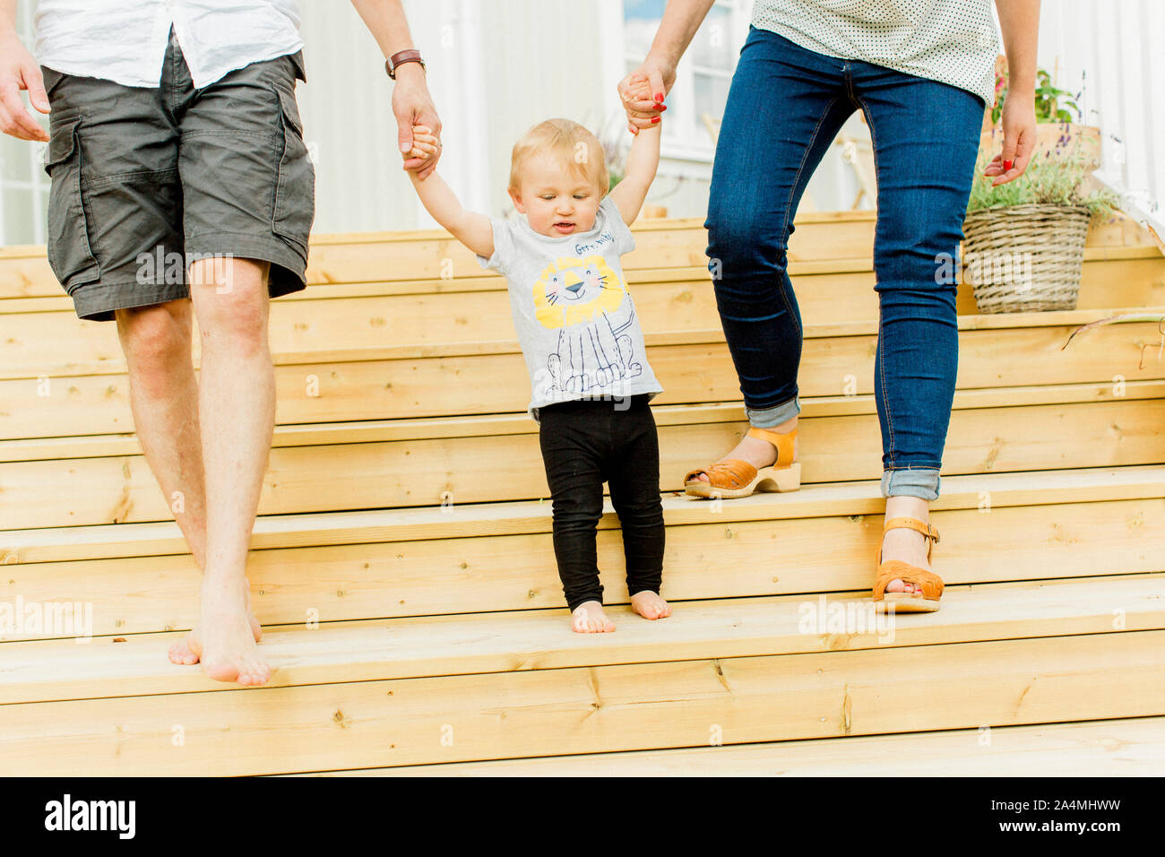 Parents Walking With Baby