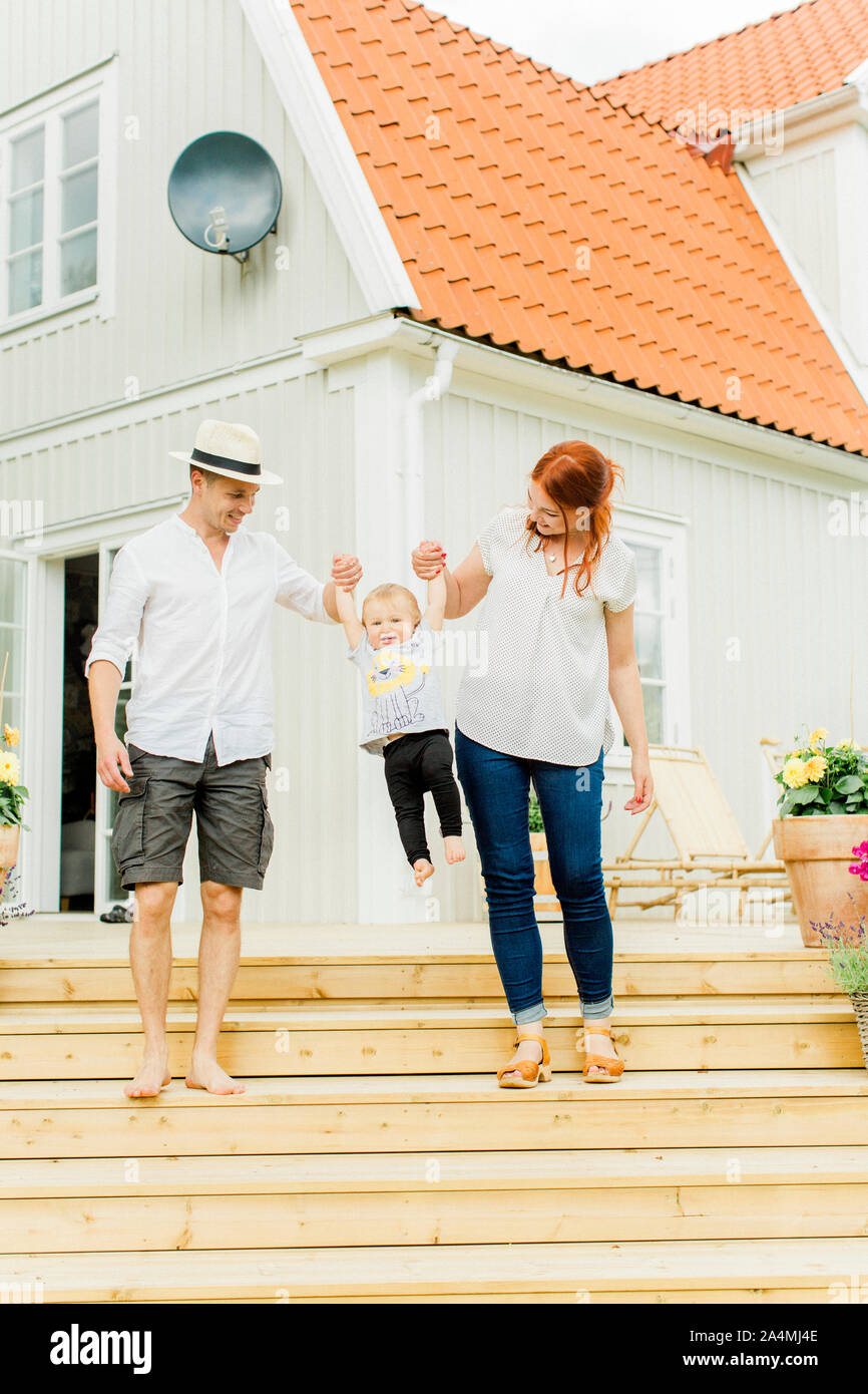 Parents with baby on stairs hi-res stock photography and images - Alamy