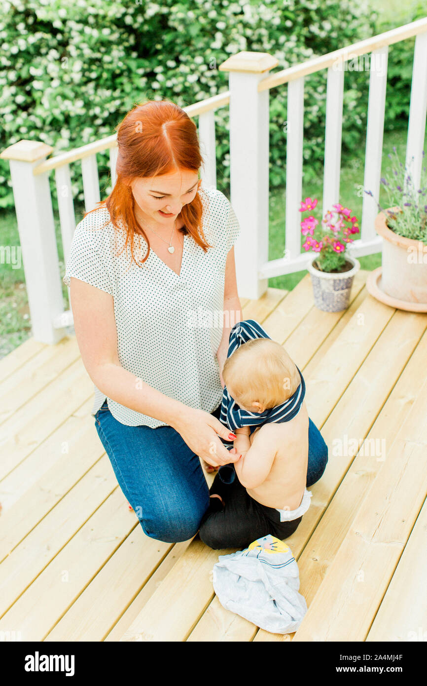 Mother assisting hi-res stock photography and images - Alamy