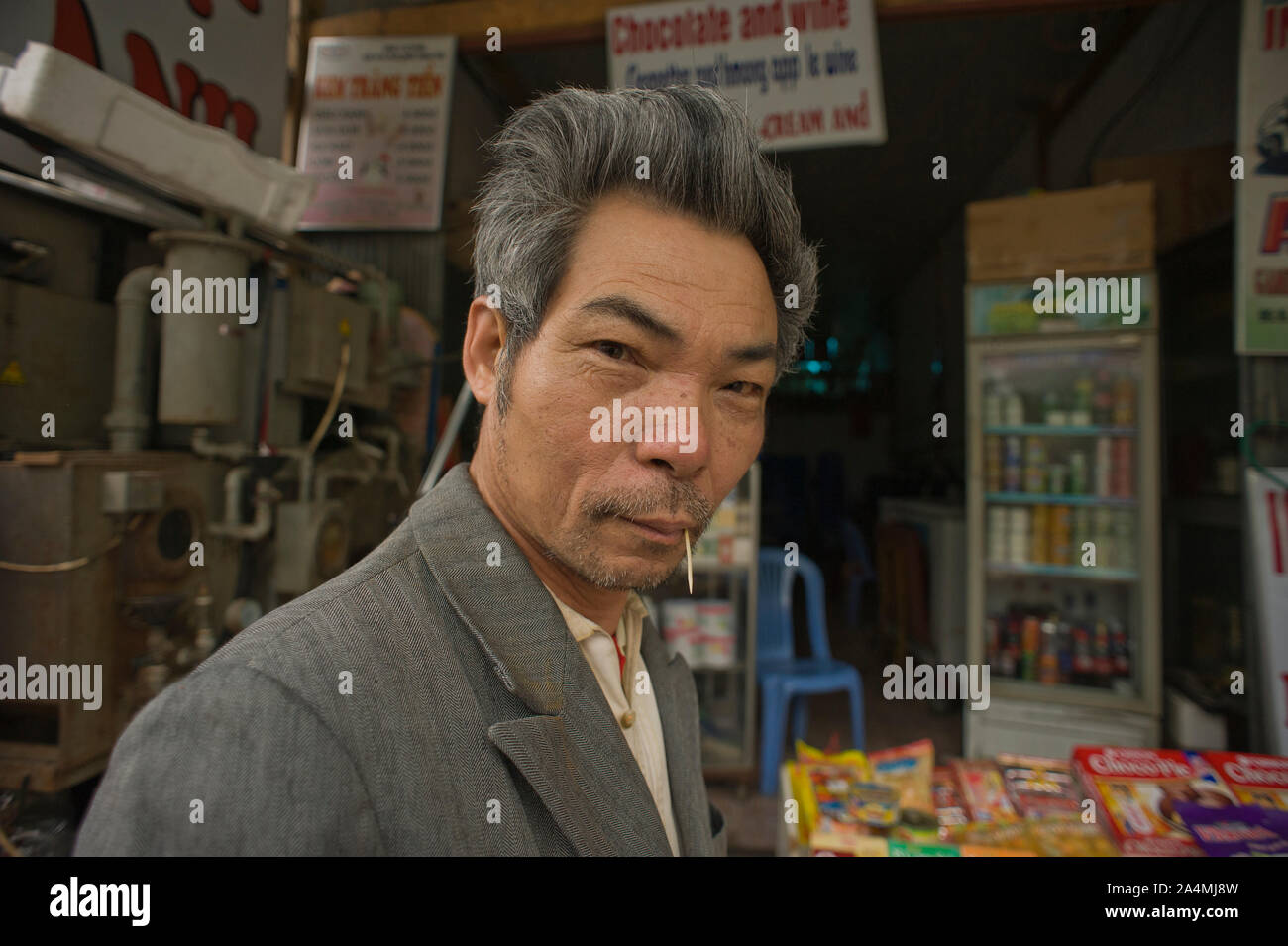 Bac Ha, Lao Cai, Vietnam - March 27, 2011: Vietnamese man in front of ...