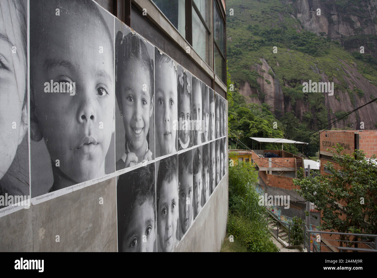 Rio de Janeiro, Brazil - March 03, 2016: Posters of kids in the wall of ...